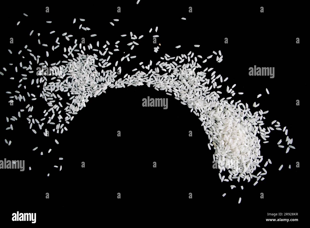 Raw white rice splash on black background. Uncooked rice explosion ...