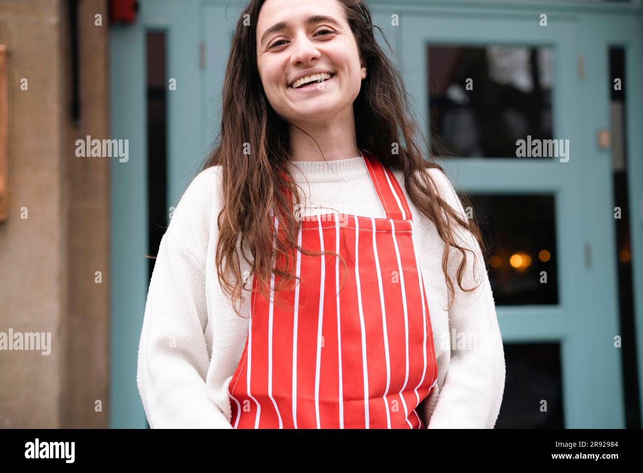Craftsman wearing brown apron hi-res stock photography and images - Alamy
