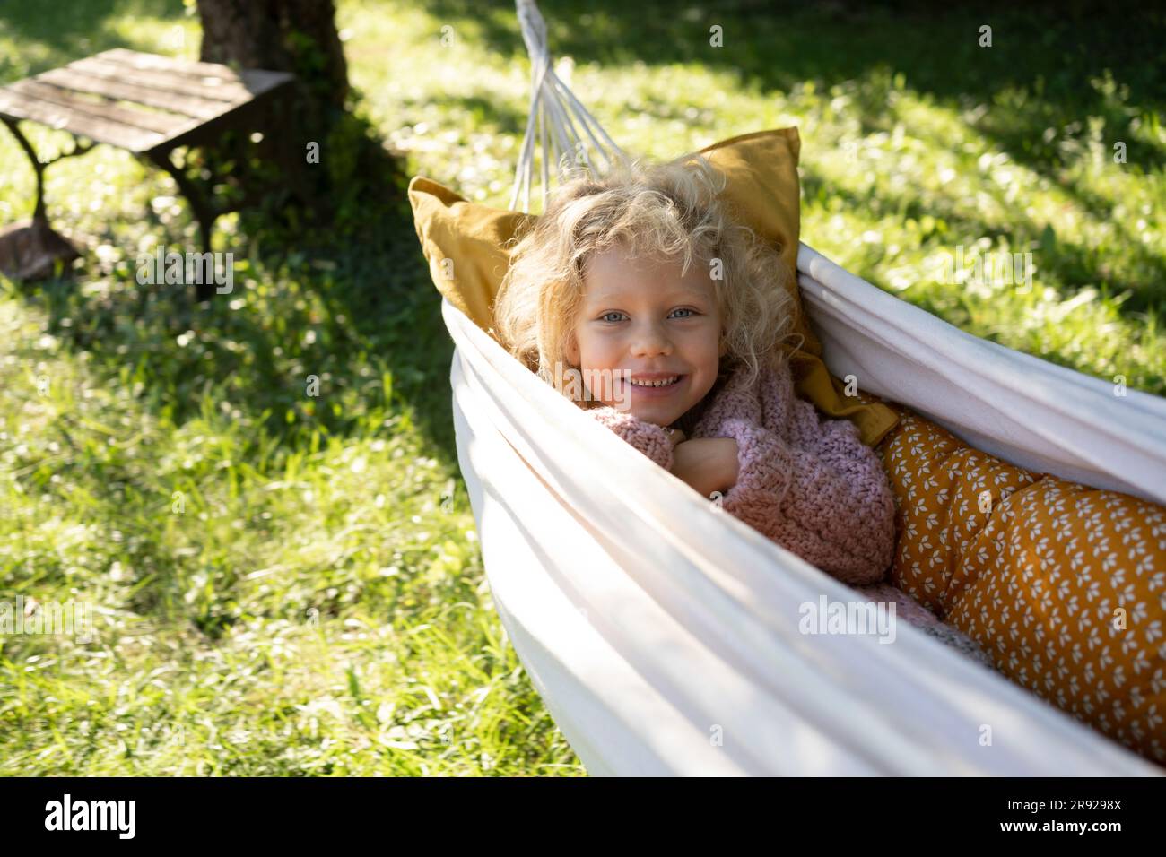 Girl lying hammock hi-res stock photography and images - Alamy