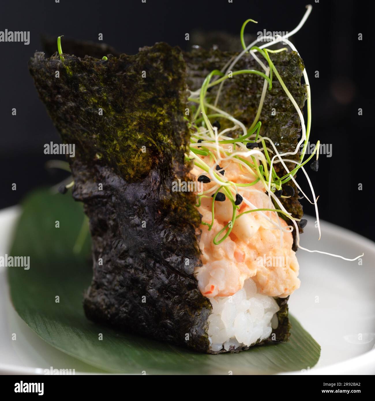 Gunkan maki sushi with tiger prawn on black background Stock Photo - Alamy