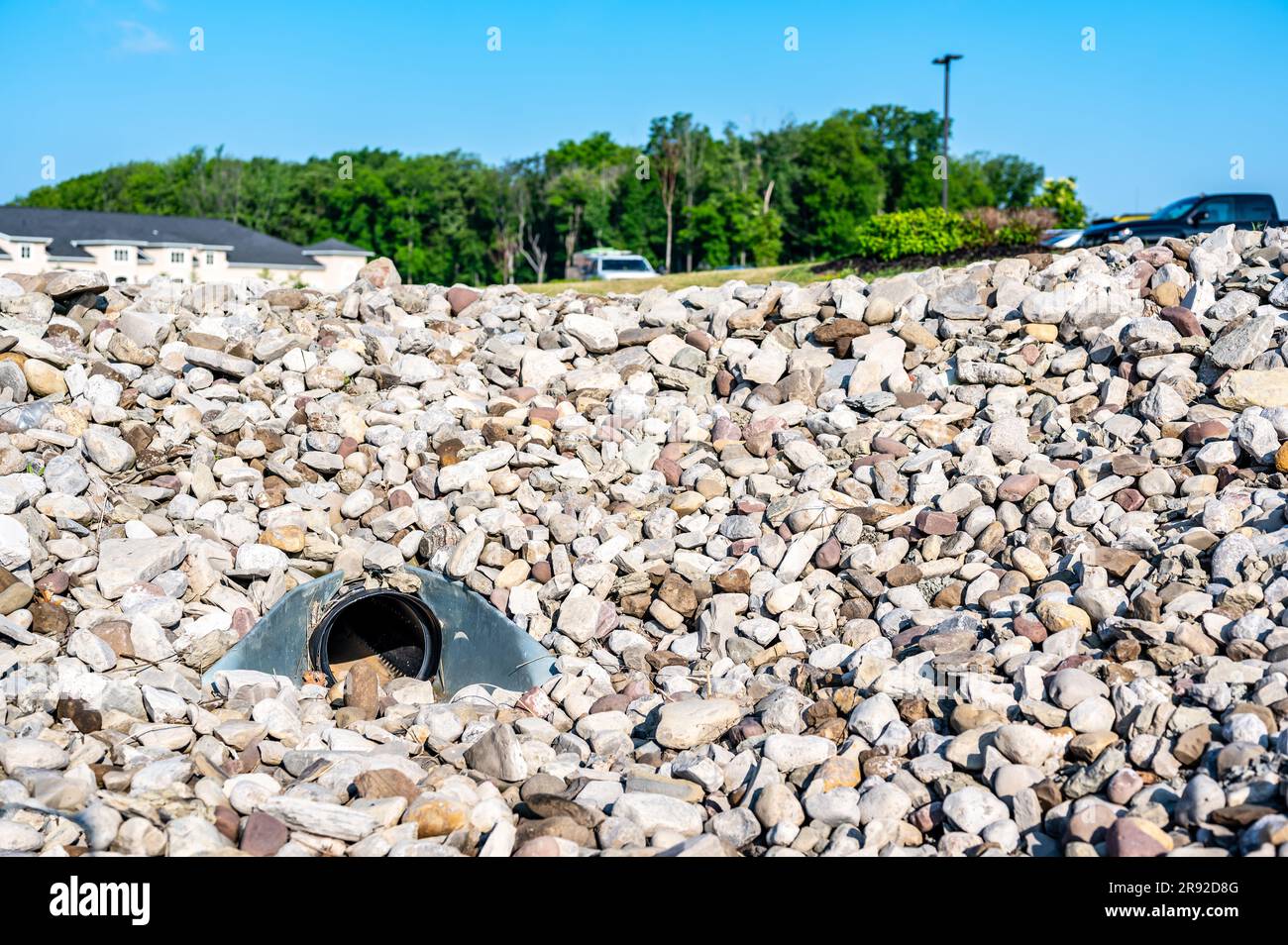 underground drainage storm drain with winged walls surrounded by rock ...