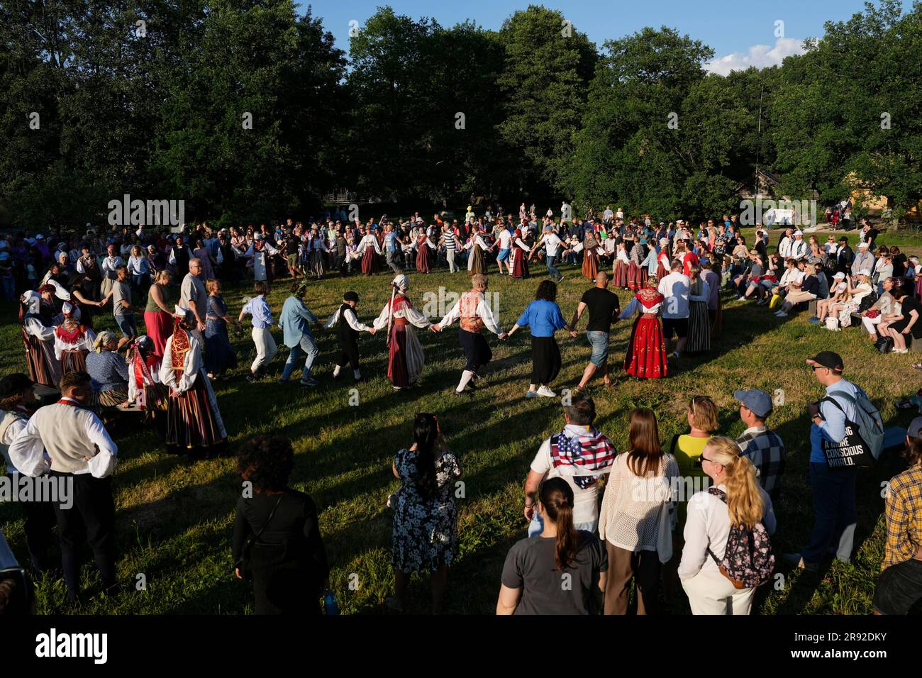 People dressed in traditional clothing dance during celebrations of ...