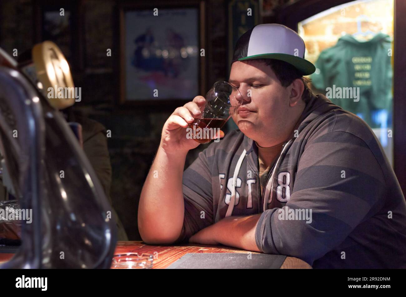 Night, beer and drink with man at pub for lager, hospitality and ...