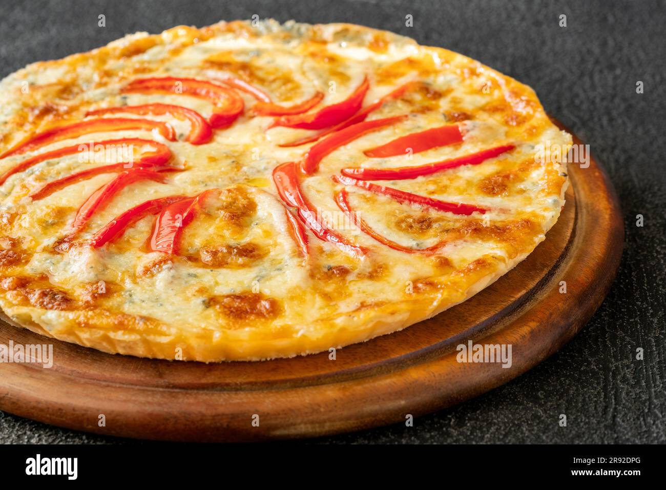 Blue cheese and red bell pepper tart Stock Photo - Alamy