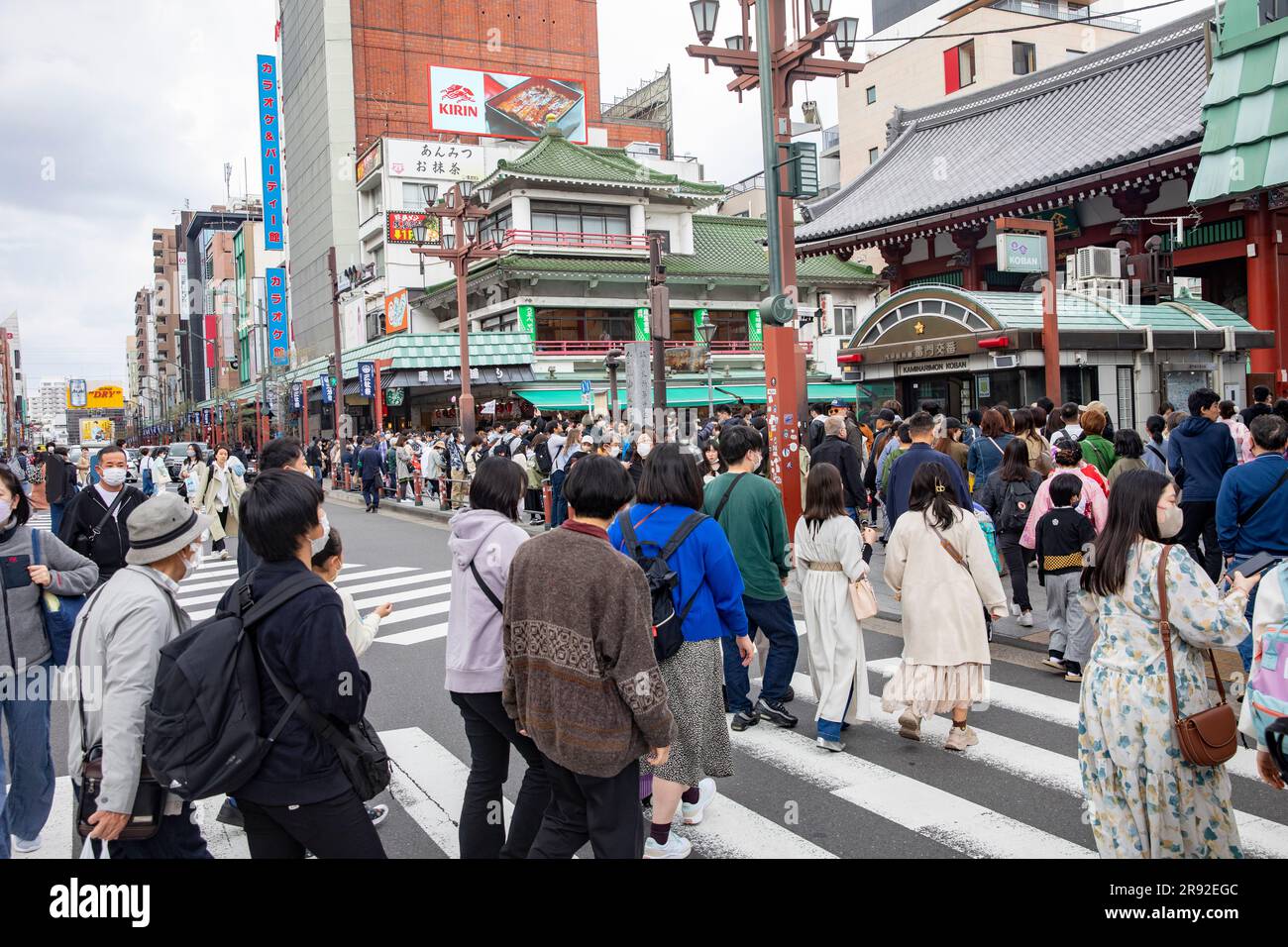 Asakusa Tokyo, busy street scene crowds of people head towards Senso ...