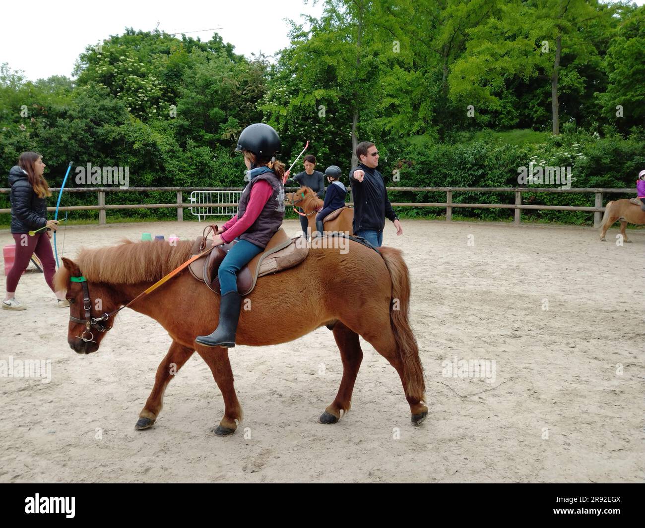 05-14-2023 Paris, France. Kids riding ponies (horses) and they shoot ...