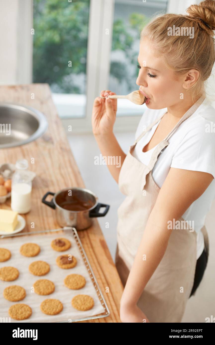Woman Taste Or Baker Baking Cookies With Dough Or Pastry Pot In A