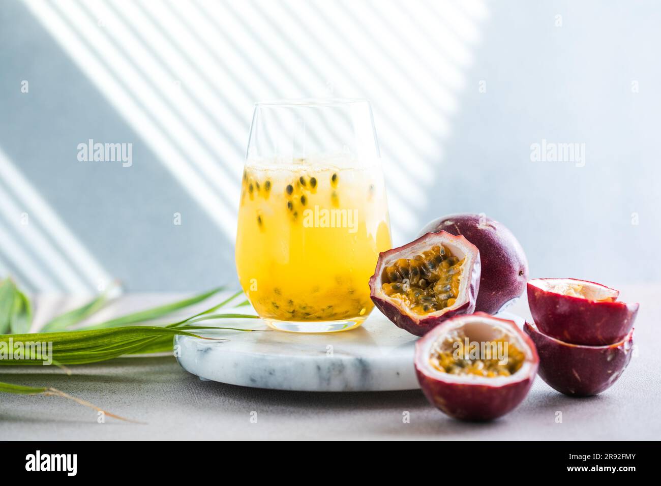 Pure passion, alcoholic cocktail with syrup, lime, orange juice, soda ...