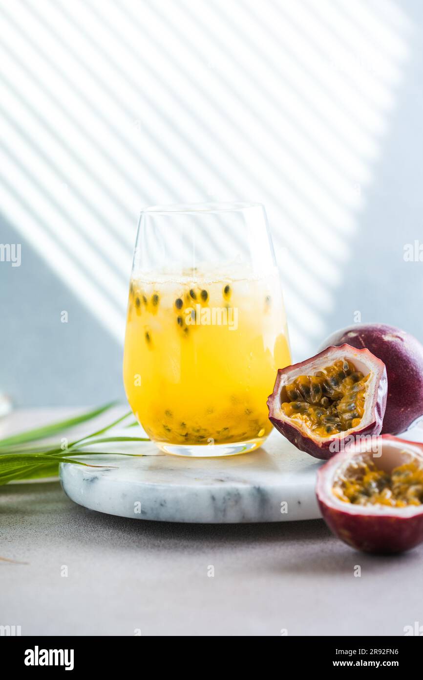 Pure passion, alcoholic cocktail with syrup, lime, orange juice, soda ...