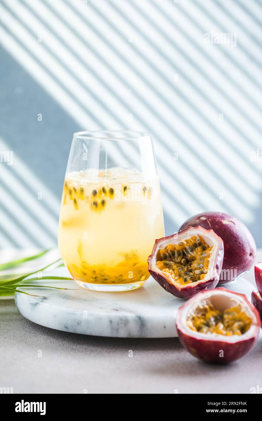 Pure passion, alcoholic cocktail with syrup, lime, orange juice, soda ...