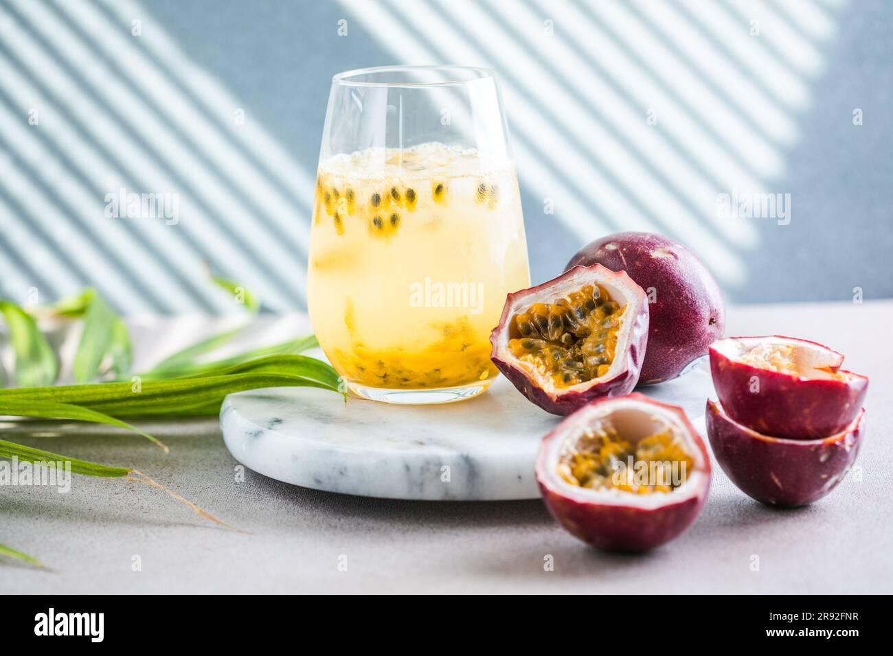 Pure passion, alcoholic cocktail with syrup, lime, orange juice, soda ...