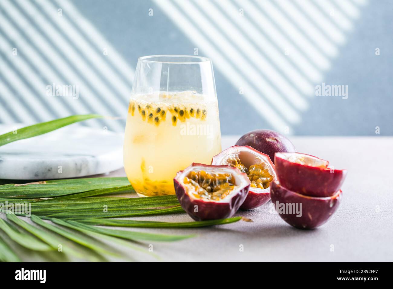 Pure passion, alcoholic cocktail with syrup, lime, orange juice, soda ...