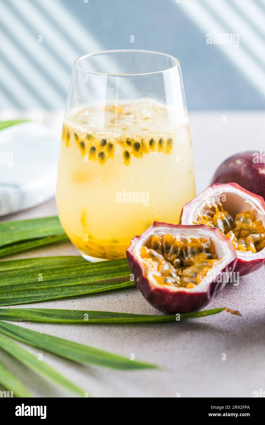 Pure passion, alcoholic cocktail with syrup, lime, orange juice, soda ...