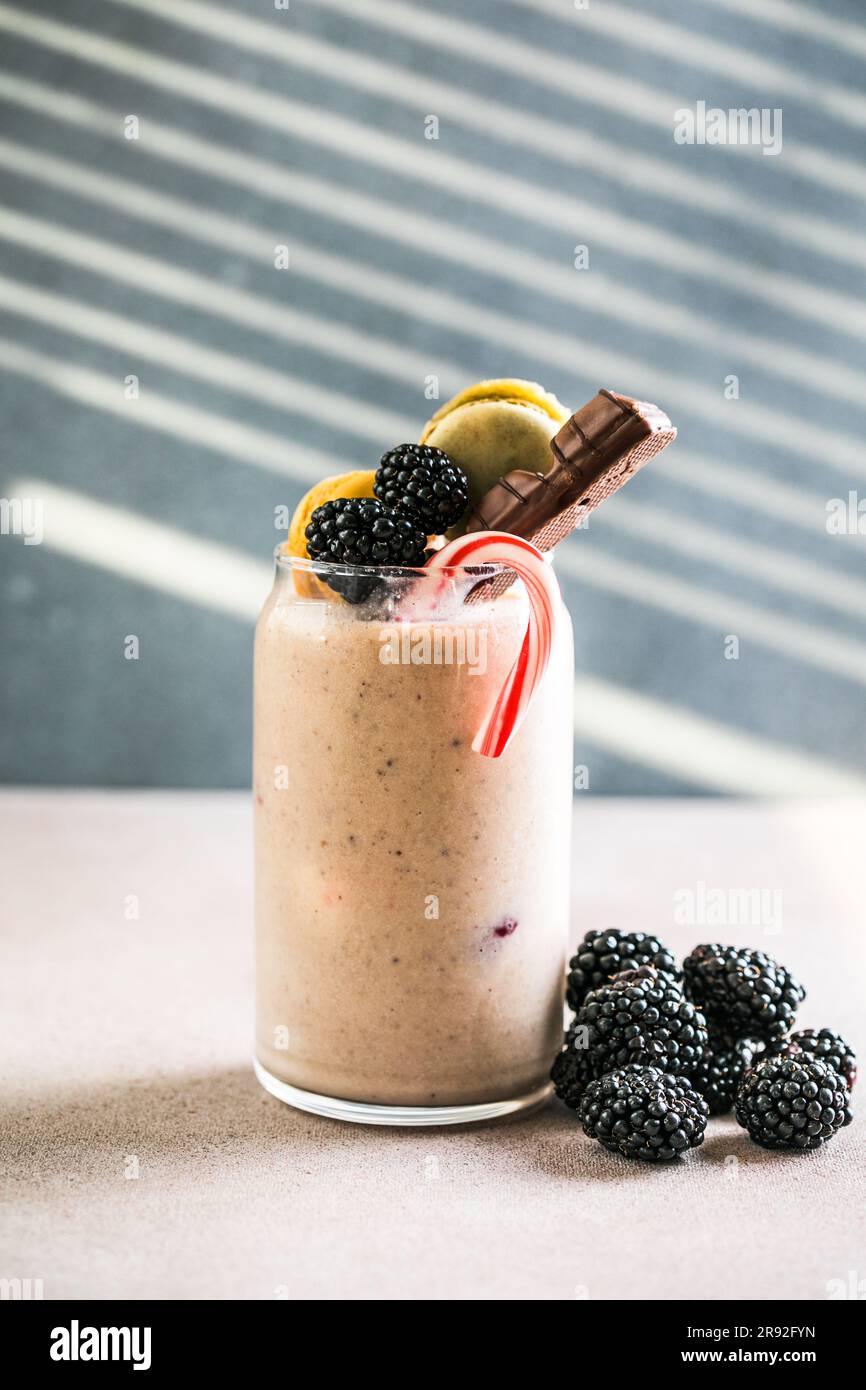 Chocolate indulgent extreme milkshake with macaroons, berry and sweets ...