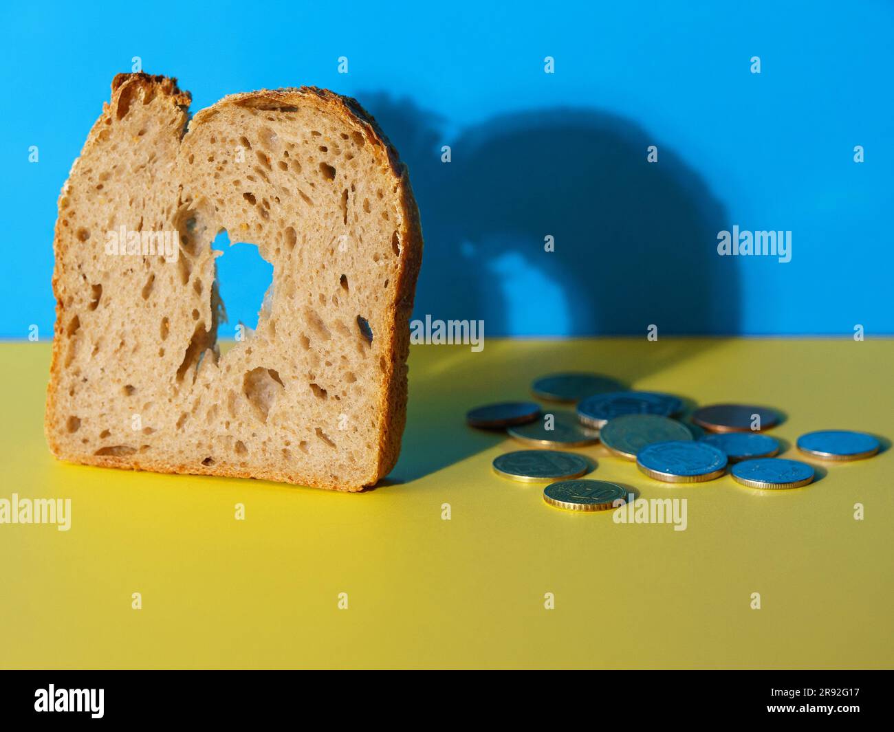 Bread and small coins Stock Photo - Alamy