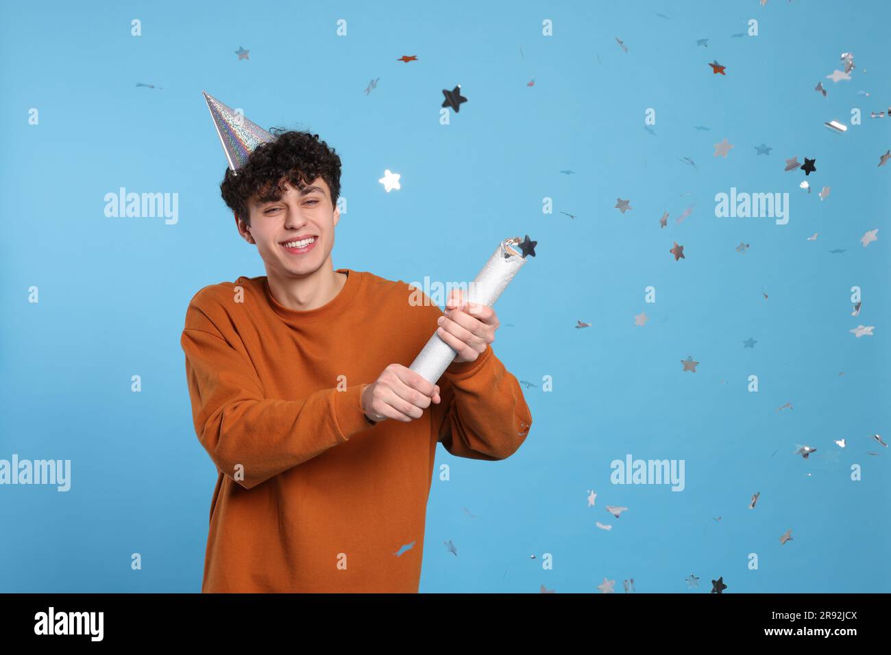 Smiling handsome man blowing hi-res stock photography and images - Alamy