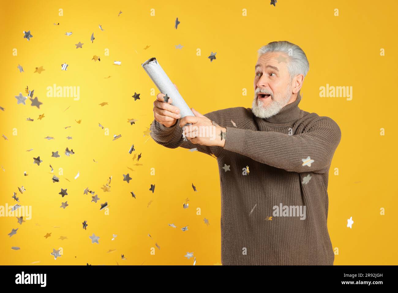 Emotional man party popper hi-res stock photography and images - Alamy