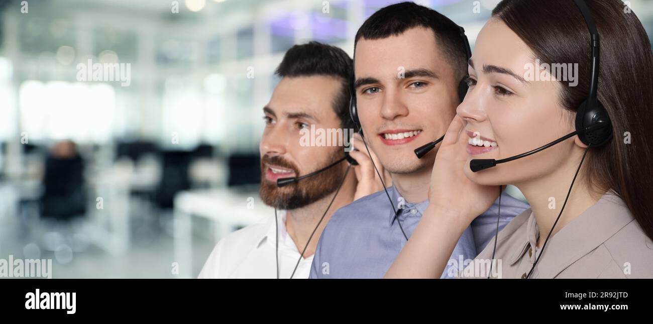 Hotline operators with headsets in office, space for text. Banner ...
