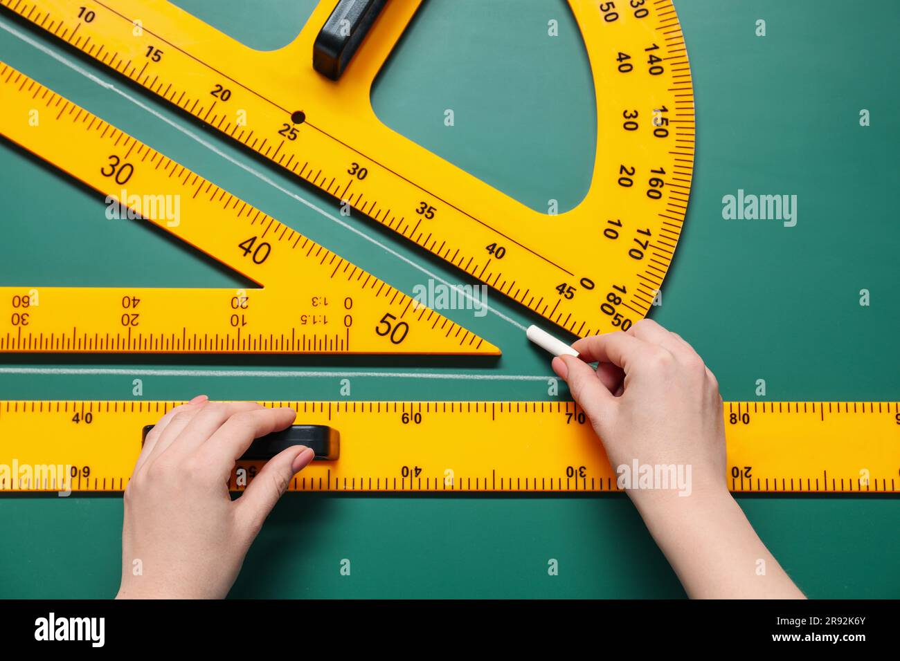 Hands measuring angle by protractor hi-res stock photography and images ...