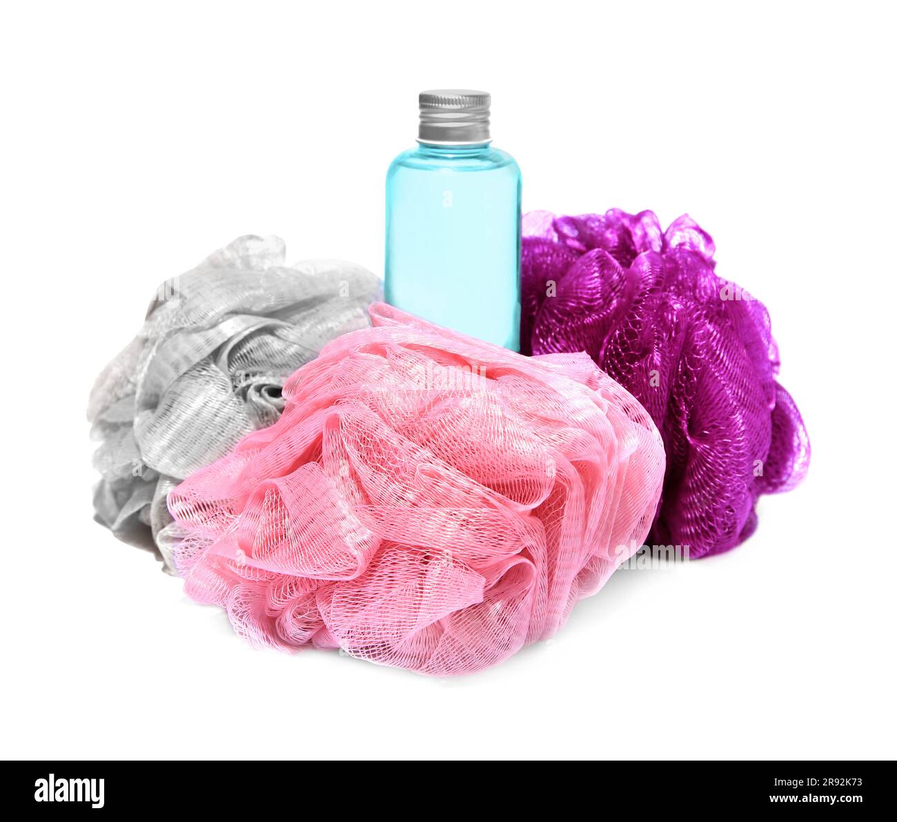 New shower puffs and bottle of cosmetic product on white background ...
