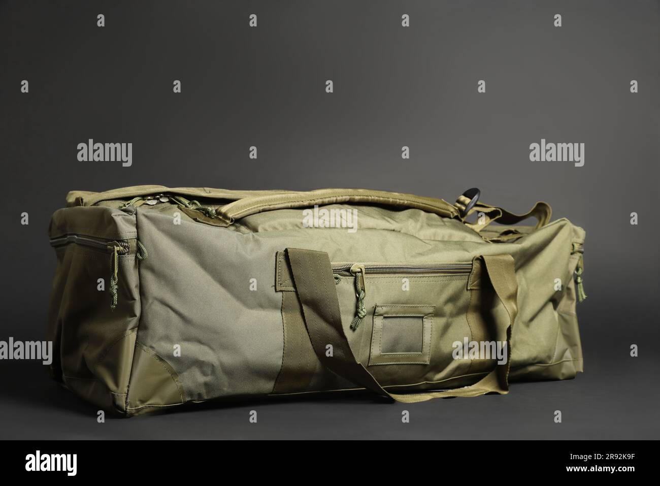 Army bag on dark grey background. Military equipment Stock Photo - Alamy