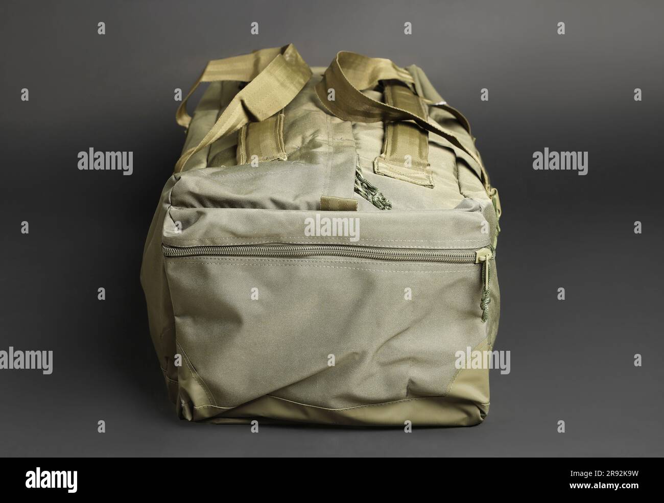 Army bag on dark grey background. Military equipment Stock Photo - Alamy