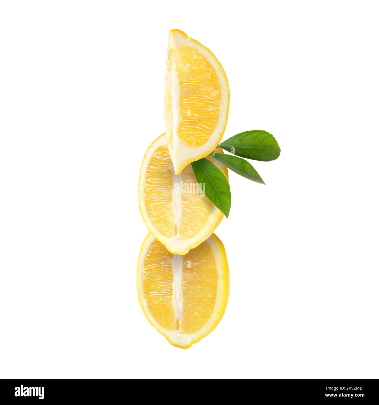 Cut fresh lemons with green leaves isolated on white Stock Photo - Alamy