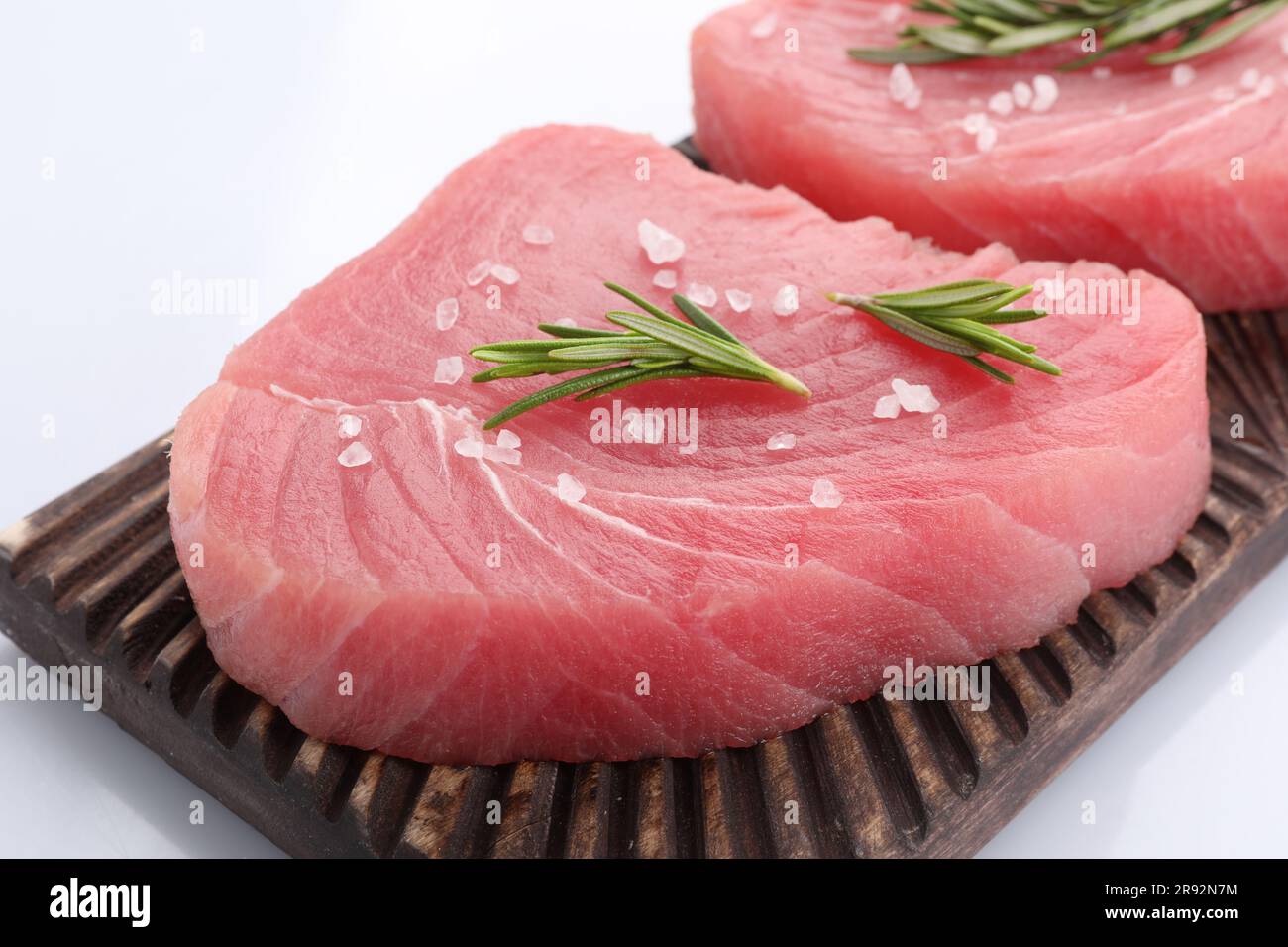 Raw tuna fillets with salt and rosemary isolated on white Stock Photo ...