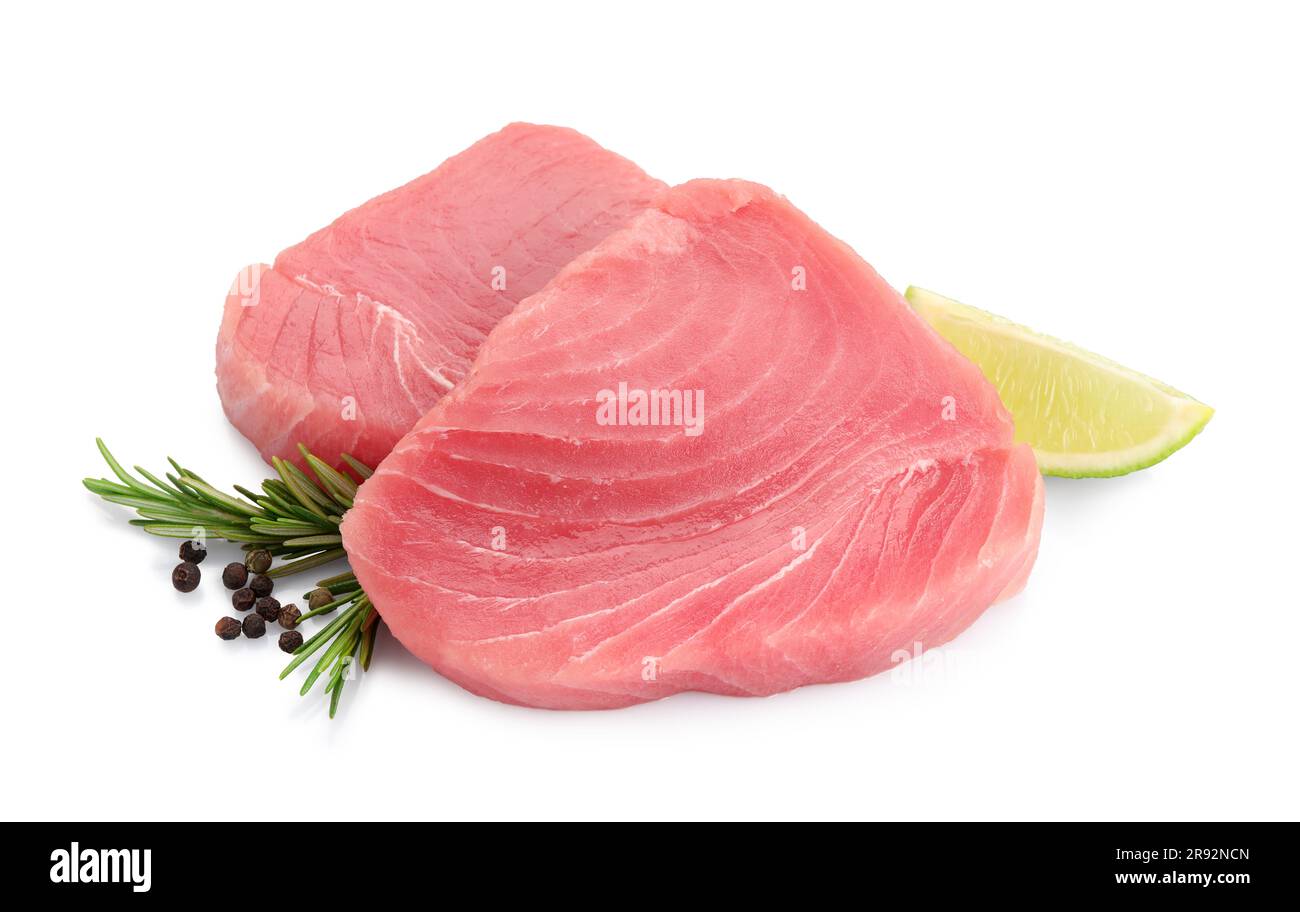 Fresh raw tuna fillets with peppercorns and rosemary on white ...