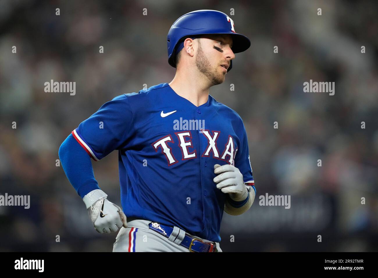 Texas Rangers' Mitch Garver runs to first after hitting an RBI single against the New York ...