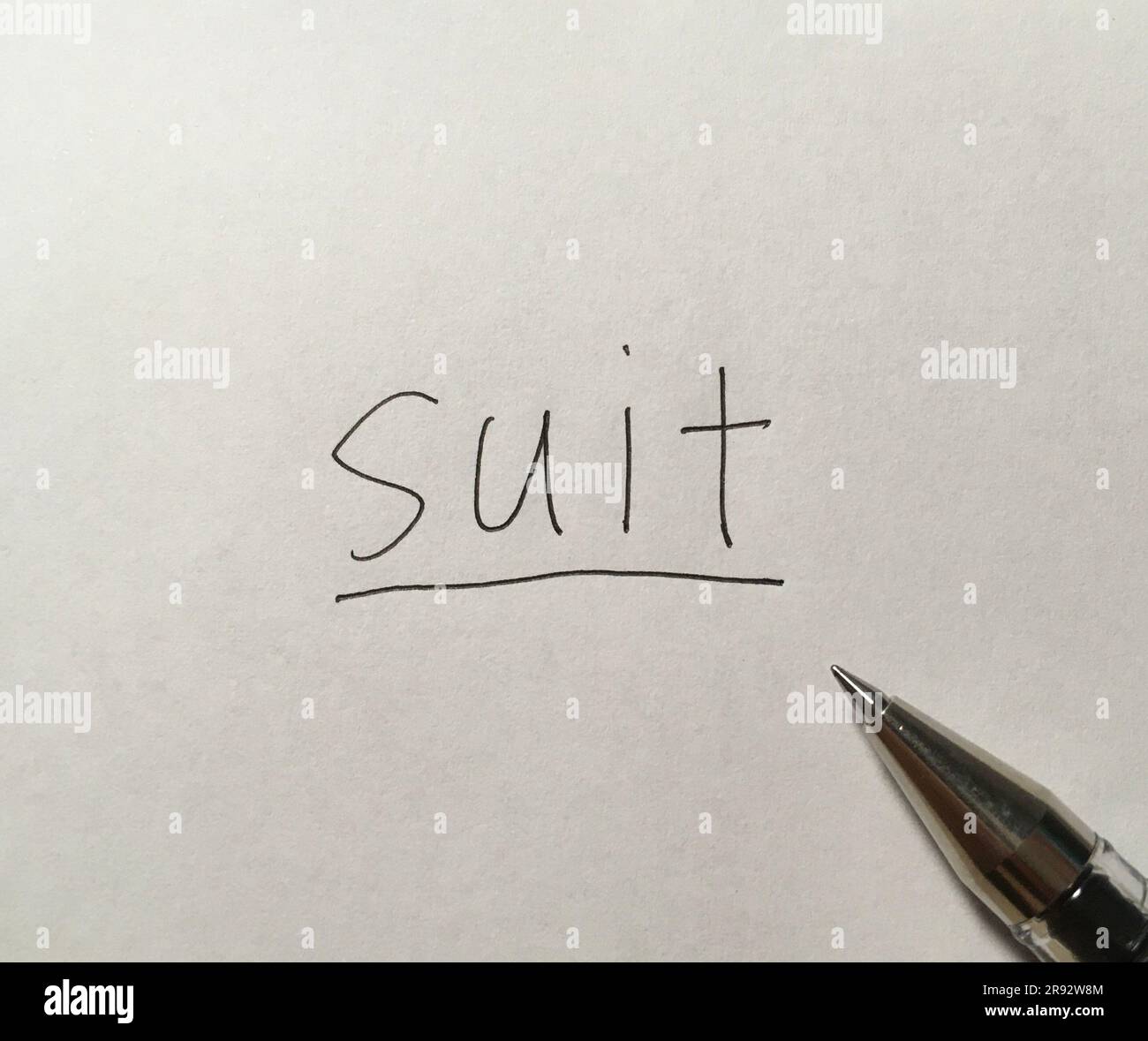 Suit concept word on paper background Stock Photo - Alamy