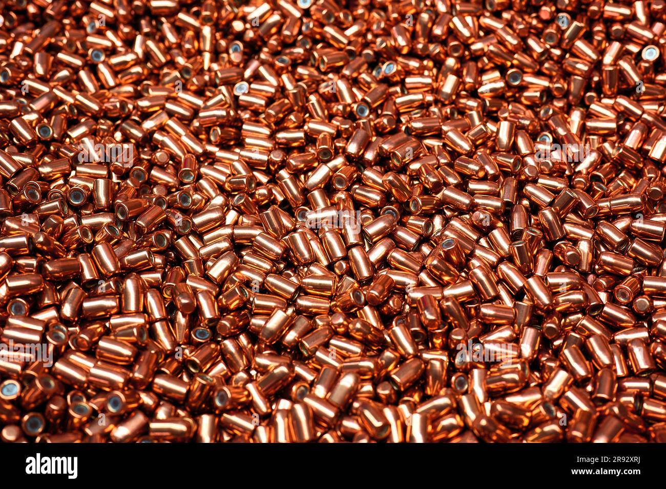 Sparkling golden bullets heap for firearms as background Stock Photo ...