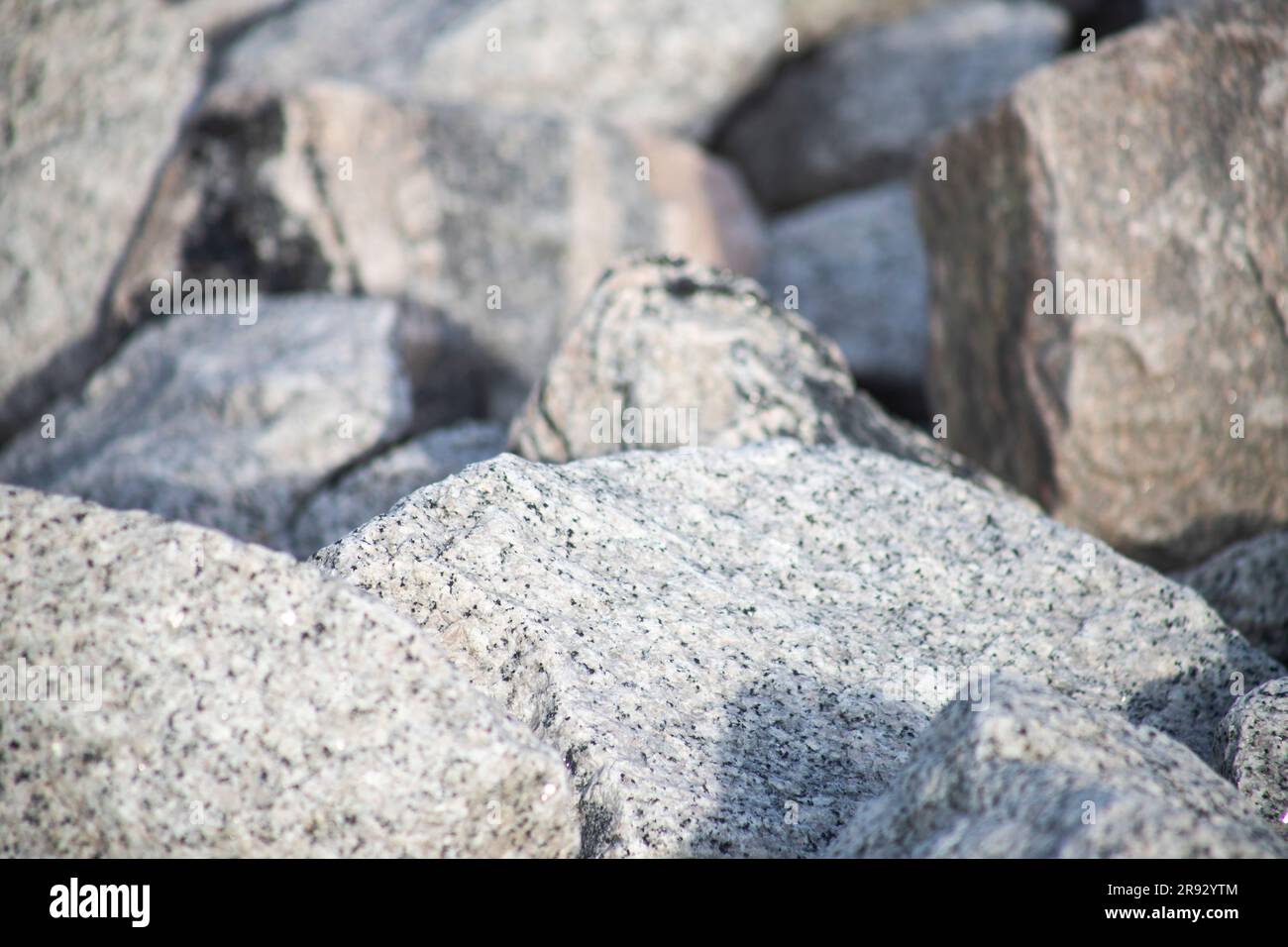 close up of granite stone rock chunks background, rock textures, river ...