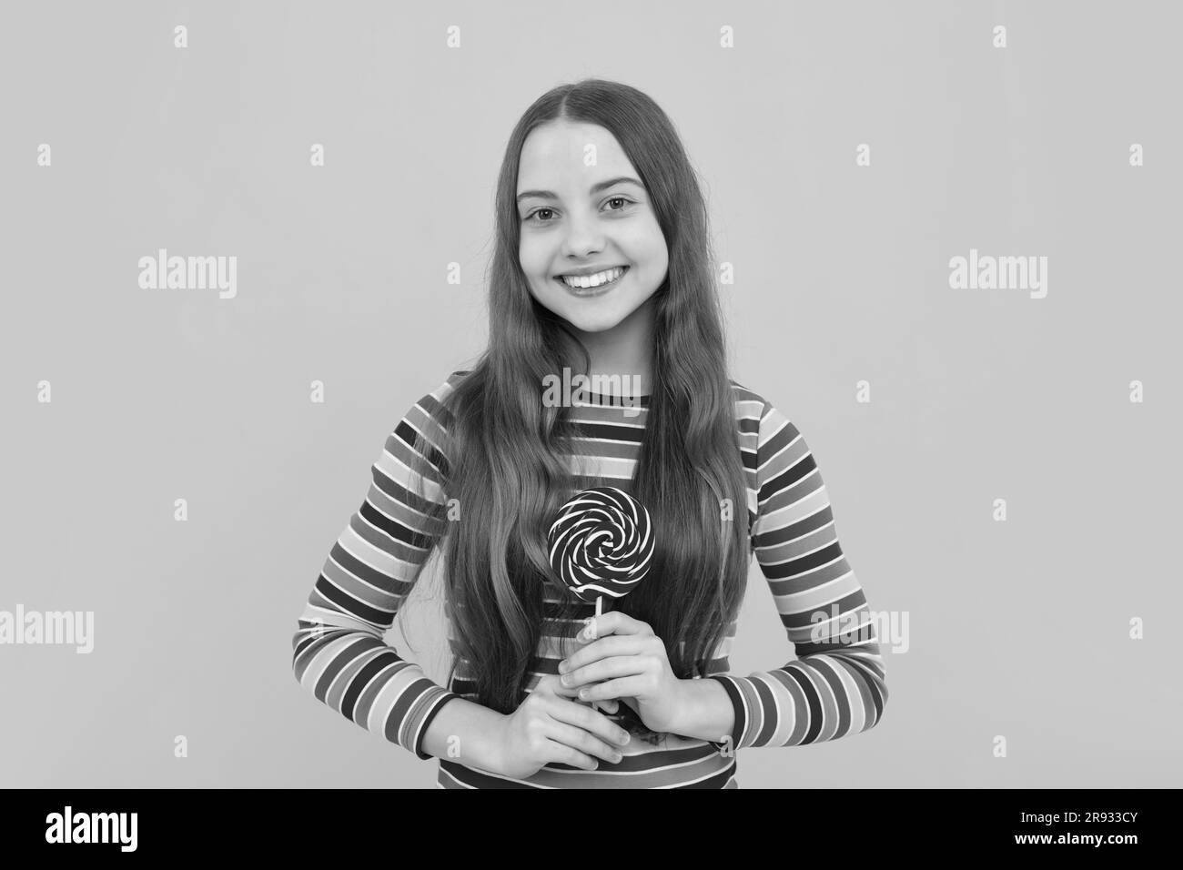 Teenager girl with caramel candies on sticks, sweet sugar addiction ...