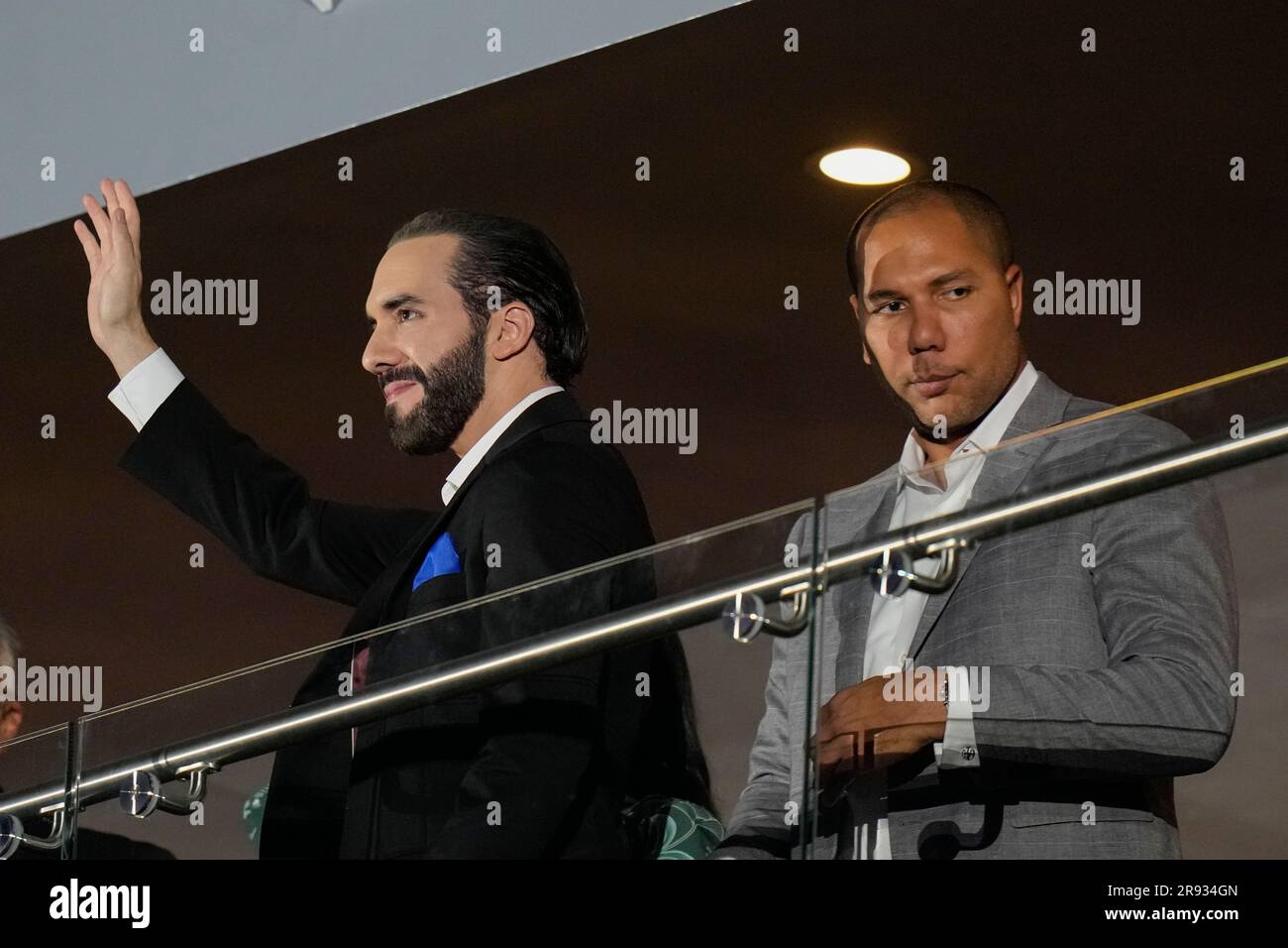 Salvadoran President Nayib Bukele, left, waves while accompanied by his ...