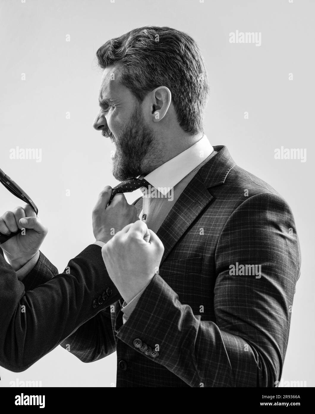 Aggressive man in suit scream fist fighting with colleague grey ...