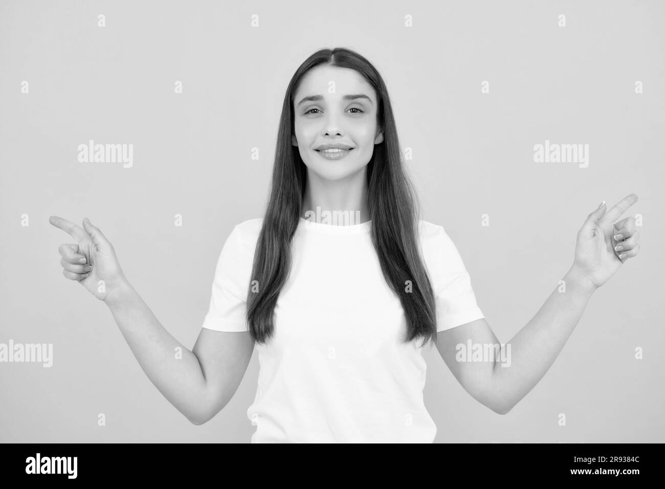 Woman point at copy space, showing copyspace pointing. Promo, girl ...