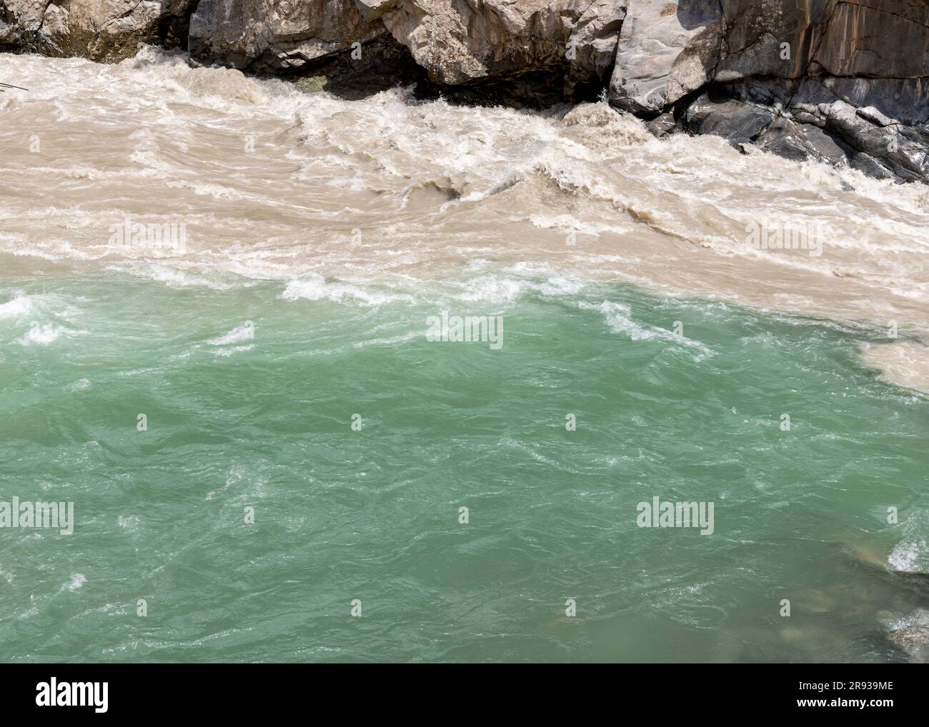 Meeting point of a green water and brown water in the river swat at ...
