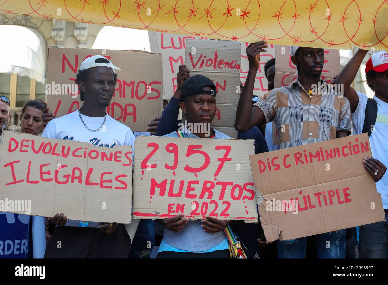 Madrid, Spain. 23rd June, 2023. A group of immigrants hold placards ...
