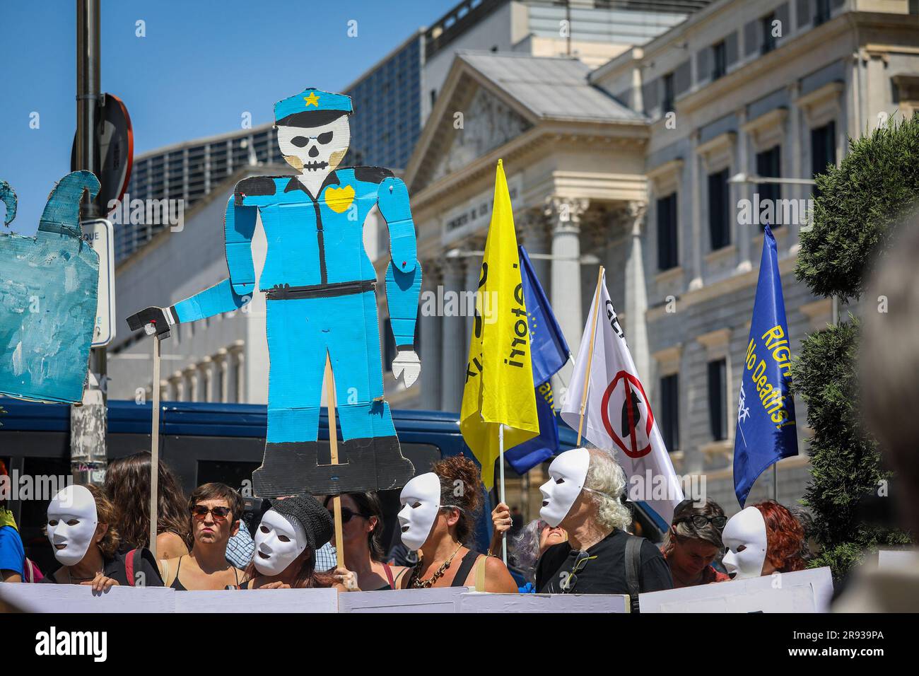 Madrid, Spain. 23rd June, 2023. A group of masked activists hold flags ...