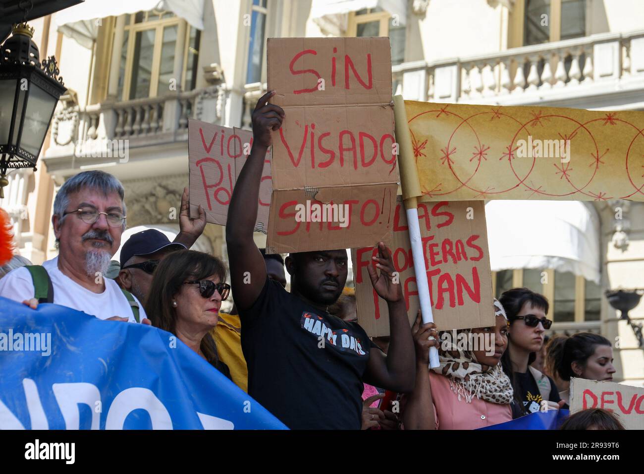 Madrid, Spain. 23rd June, 2023. A group of immigrants hold placards ...