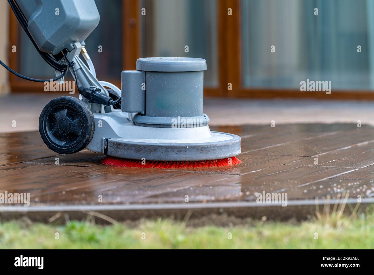 manual cleaning of concrete and stone terraces of the house with a ...