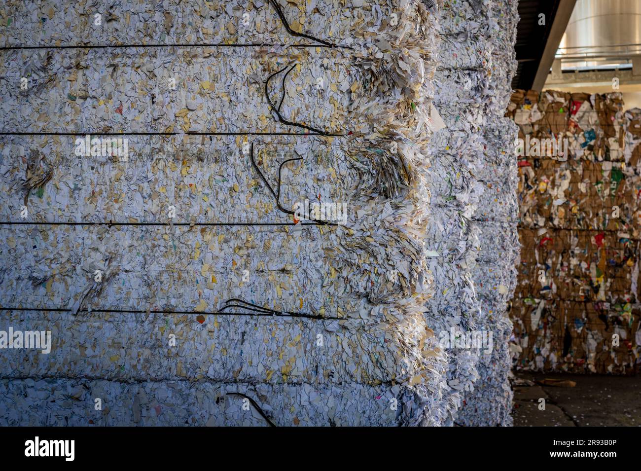 Stacked packages of shredded waste paper for recycling in Switzerland ...