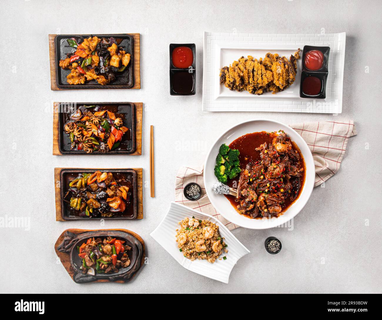 Assorted variety of asian chinese food table Stock Photo - Alamy