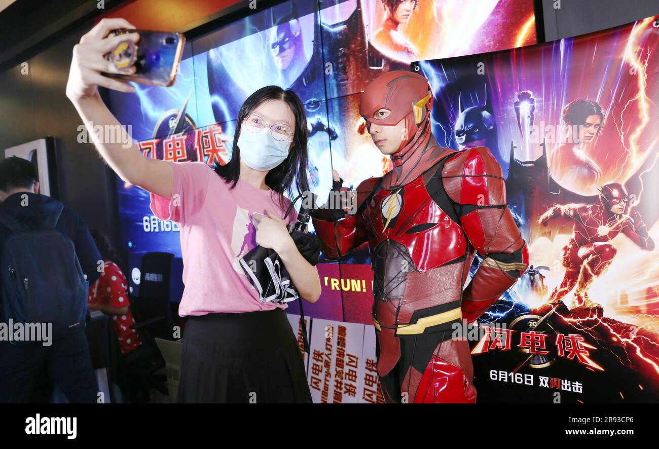 SHANGHAI, CHINA - JUNE 13, 2023 - A fan poses with COSPLAY superhero ...