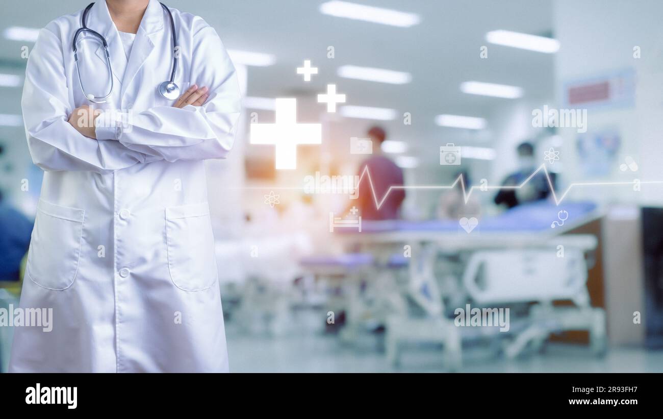 Doctor in lab coat and stethoscope Standing with arms crossed on ...