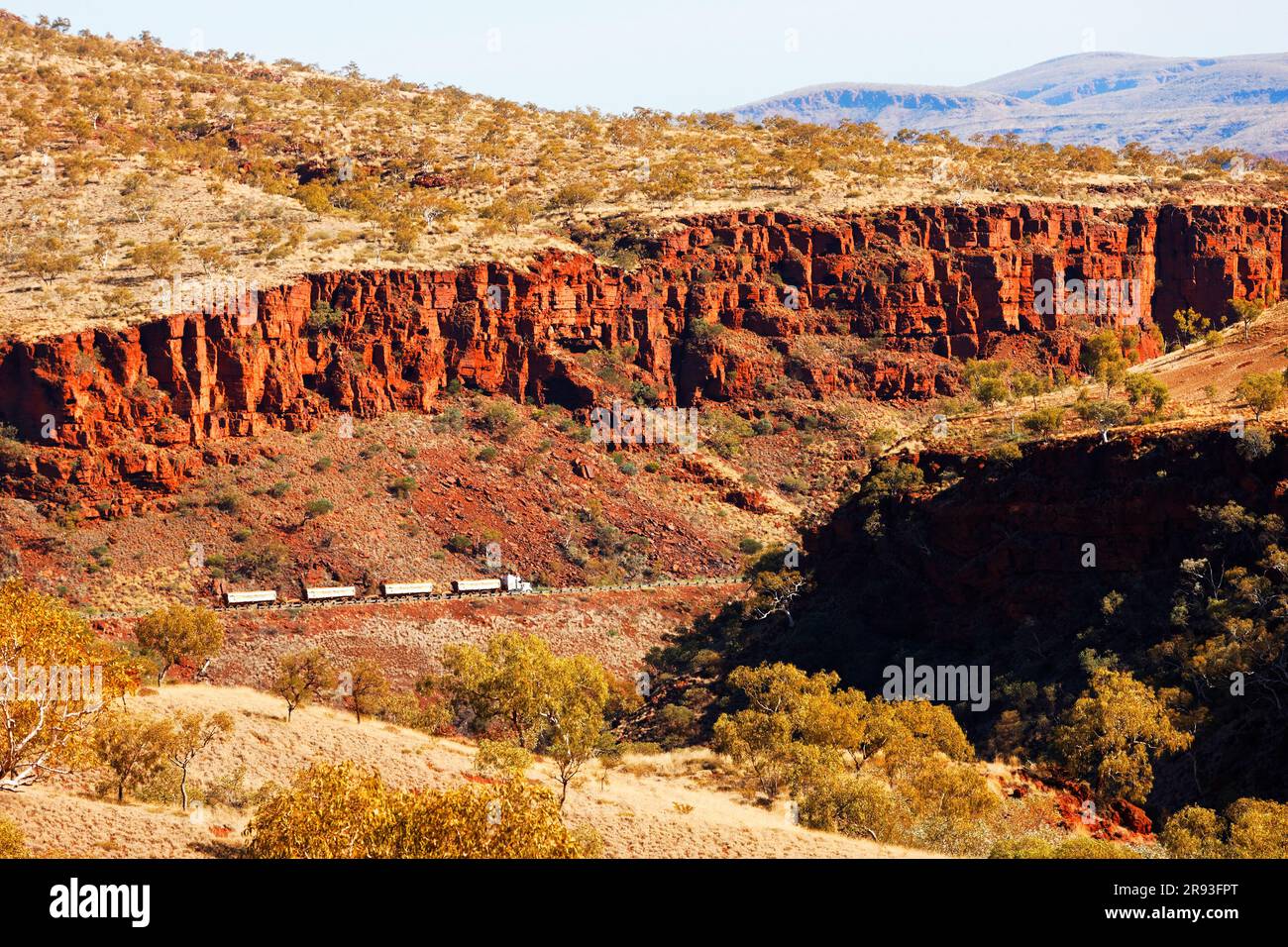 Road train truck dwarfed by the Munjina Gorge landscape, Pilbara ...