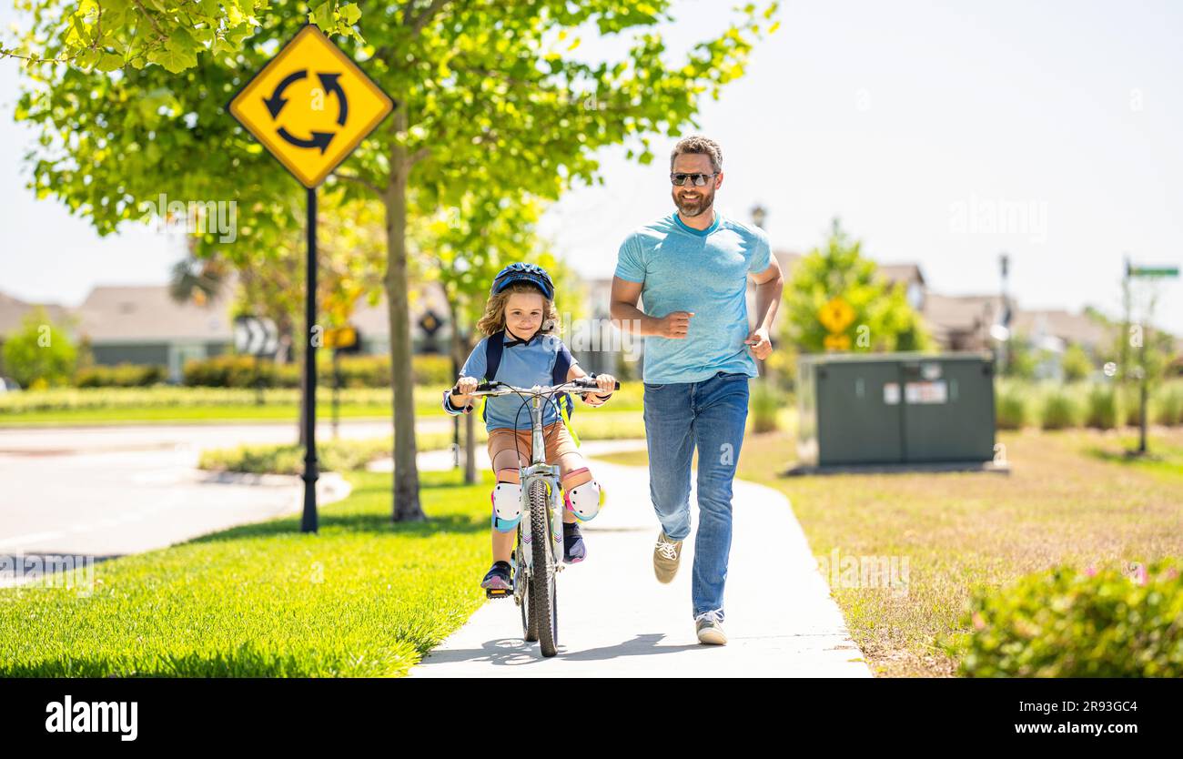 dad and son on biking adventure. dad and son duo pedaling through ...