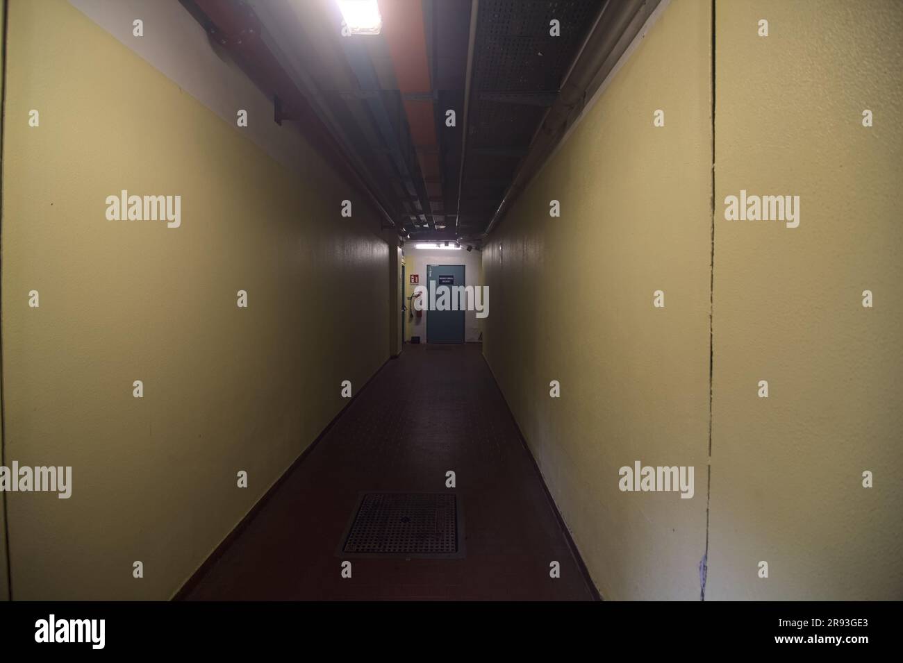 Dark and narrow corridor with neon lights Stock Photo - Alamy