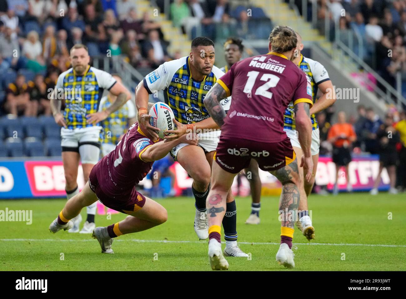 Sam Lisone #15 of Leeds Rhinos charges at the Huddersfield Giants ...